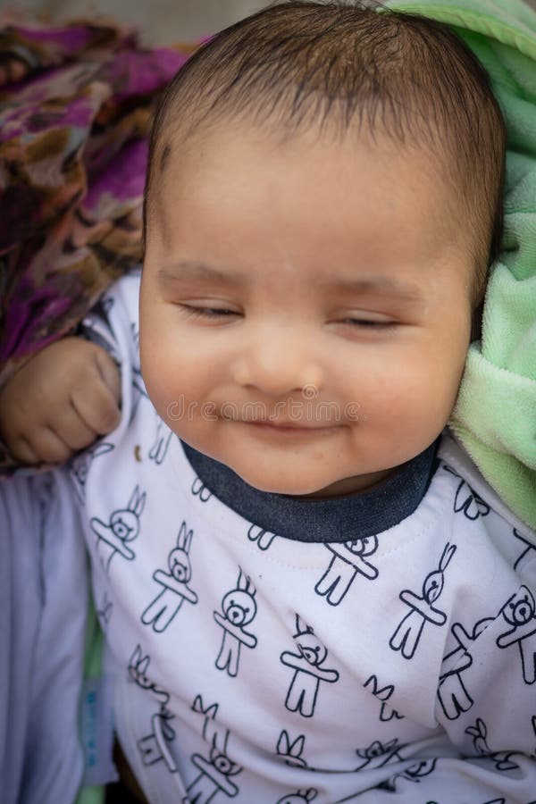Cute Infant Facial Expression Resting from Top Angle Stock Photo ...