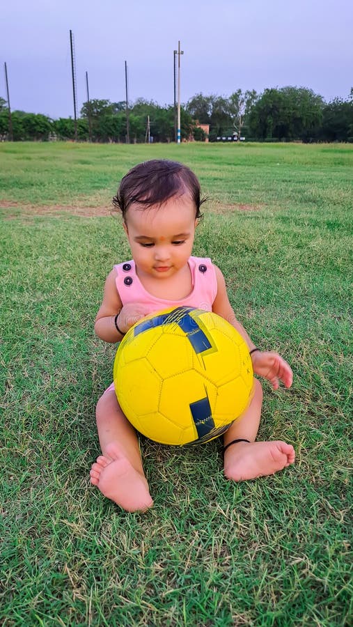 Cute Infant Playing with Football at Green Grass Field from Different ...