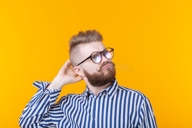 Cute Intelligent Young Man with a Beard and with Glasses Poses on a ...