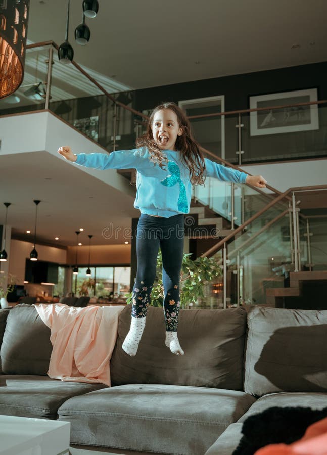 Cute Joyful Child Jumping on Te Couch Stock Photo - Image of luxury ...