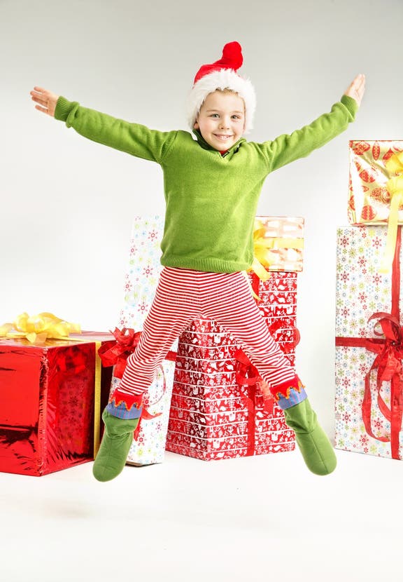 Cute Jumping Elf with Presents in the Bacground Stock Photo - Image of ...
