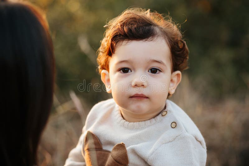 Cute Kid Boy is Posing in the Forest, Thinking about Something Stock ...