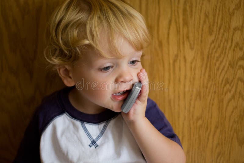 Cute Kid with Cell Phone stock image. Image of calling - 10527223