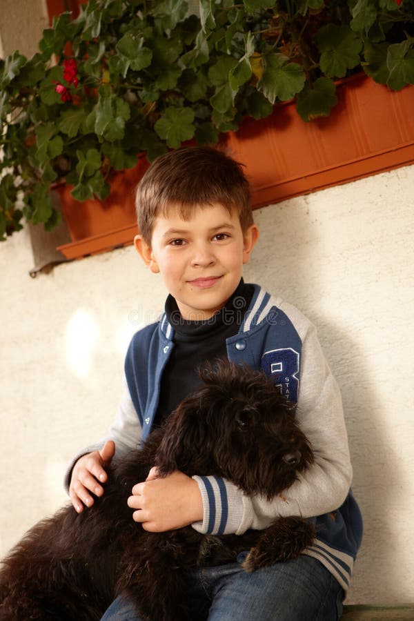 Cute kid with dog stock photo. Image of cuddling, cute - 50080868