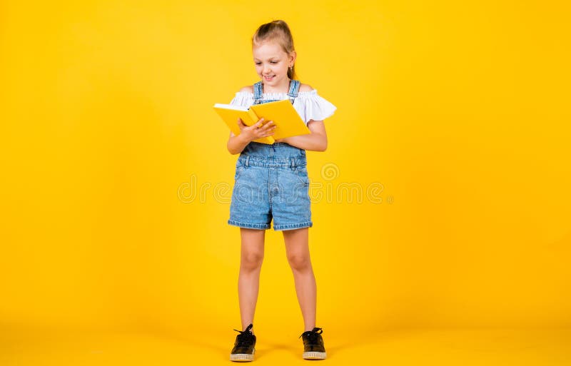 Cute Kid Going To Read Information from Book, Back To School Stock ...