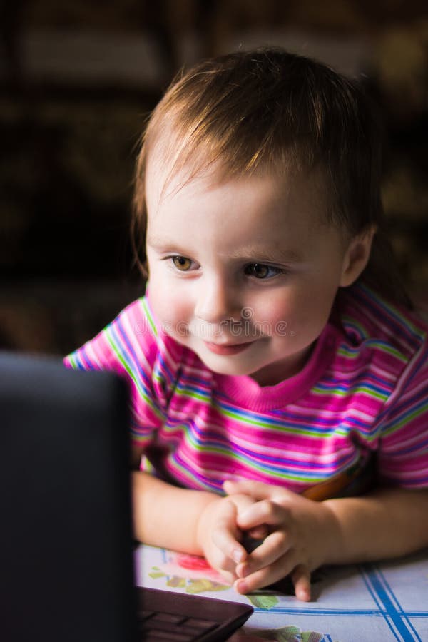 Cute kid with a laptop. stock photo. Image of beautiful - 29652072