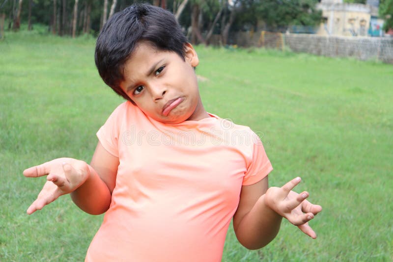 A Cute Kid with No Idea Expression Stock Image - Image of idea, play ...