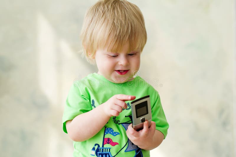 Cute Kid Playing with Cell Phone Stock Photo - Image of life, funny ...