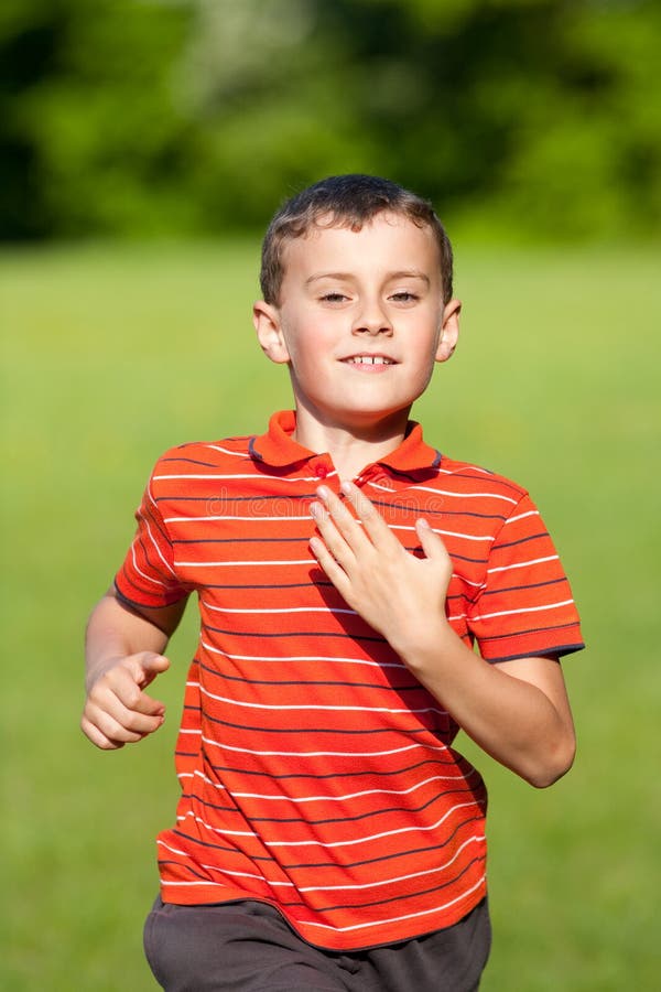 Cute kid running on grass stock photo. Image of green - 14326814