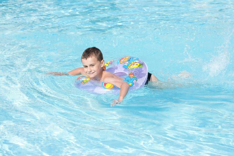 Cute kid swimming in pool stock photo. Image of secured - 10273766