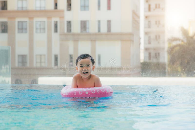 Cute Kid Swimming in a Pool with Clear Water Stock Photo - Image of ...