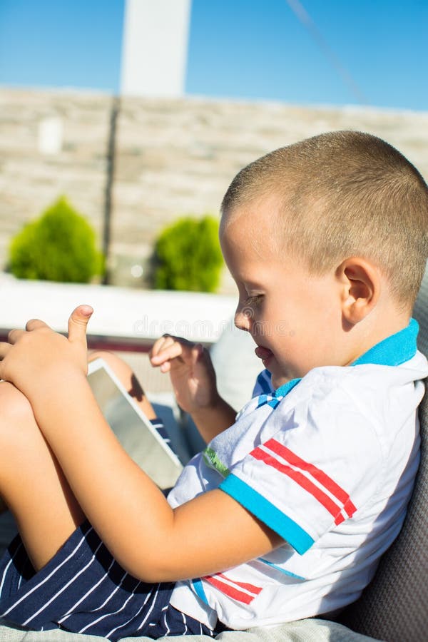 Cute kid with Tablet stock image. Image of blue, cute - 67310595