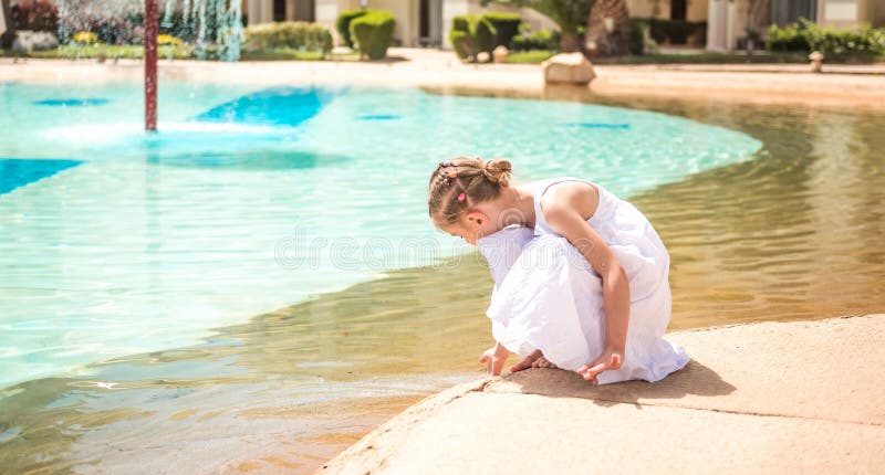 Cute Kid Walking by the Pool Stock Photo - Image of pool, resort: 144560126