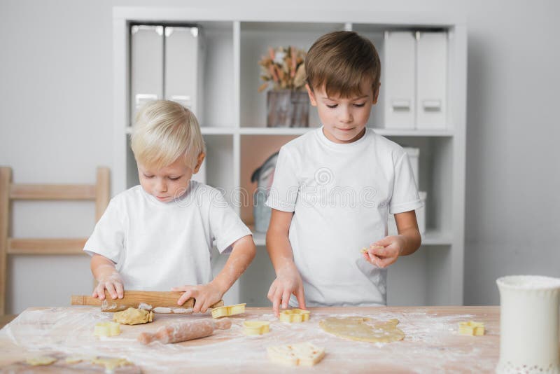 Cute Kids Cooking Cookies at the Kitchen Table. Stock Photo - Image of ...