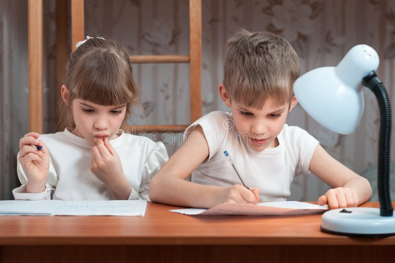 Cute Kids Do Their Homework Stock Photo - Image of lamplight, book ...