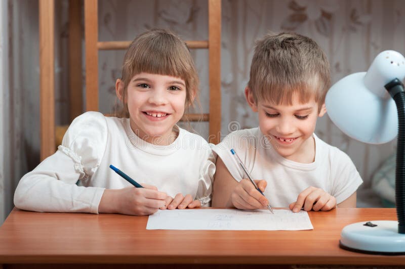Cute Kids Do Their Homework Stock Photo - Image of lamplight, book ...
