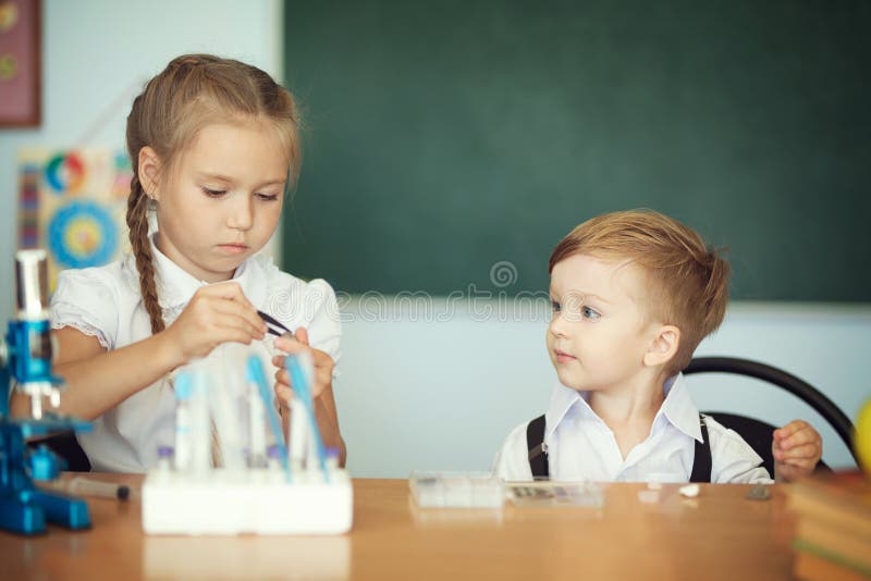 Cute Kids Studying, Smart Girl and Boy Doing Home Work Stock Photo ...