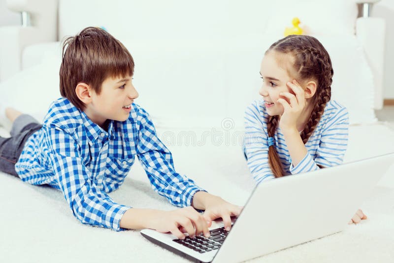 Cute kids using devices stock image. Image of childhood - 66440339