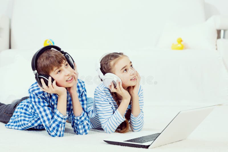 Cute kids using devices stock photo. Image of indoors - 66559032