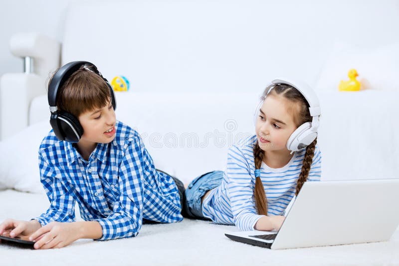 Cute kids using devices stock photo. Image of childhood - 66559320