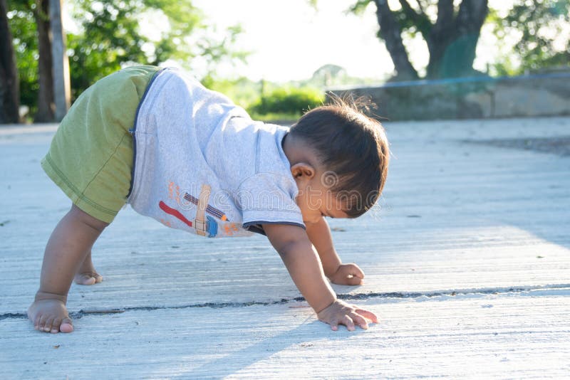 Cute Little Asian Baby Stoop on Floor Stock Photo - Image of grass ...