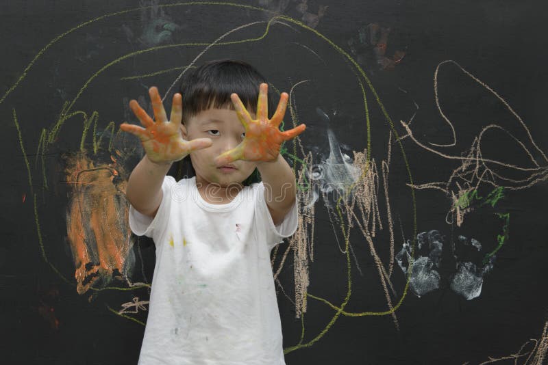 Cute Little Asian Boy Enjoying Arts and Crafts Painting with His Hands ... Cute Little Asian Boy Enjoying Arts and Crafts Painting with His Hands ...