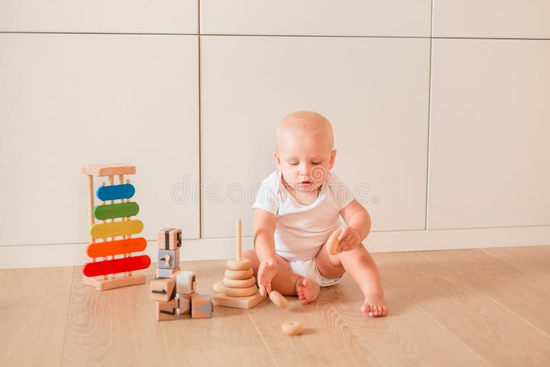 Cute Little Baby Boy Playing with Stacking Rings Stock Photo - Image of ...