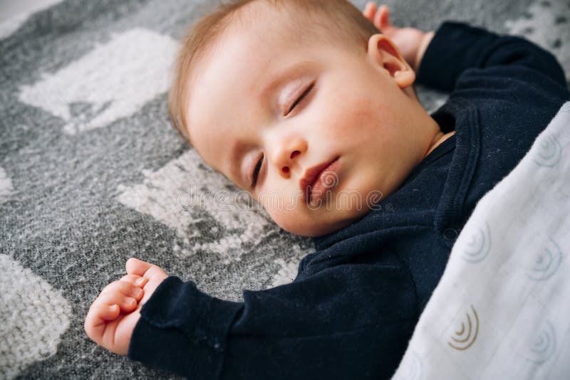 Adorable baby boy sleeping stock photo. Image of child - 128373942