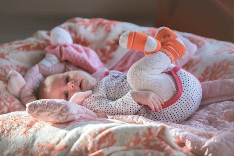 Cute Little Baby Laying on Back on the Soft Cover Stock Image - Image ...