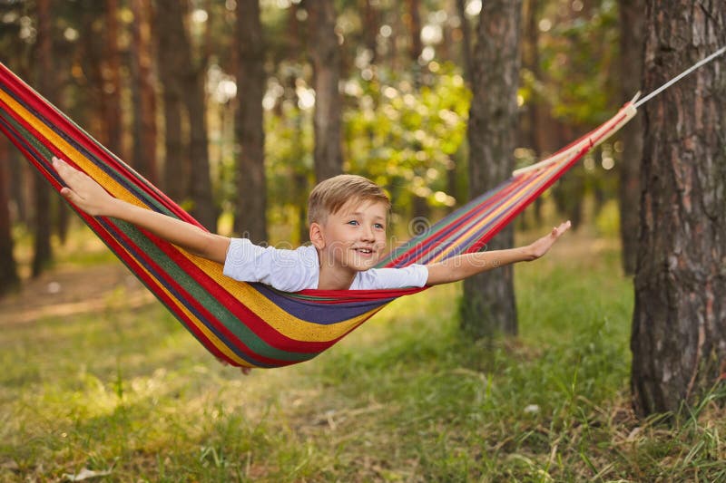 Cute Little Blond Caucasian Boy Having Fun with Multicolored Hammock ...