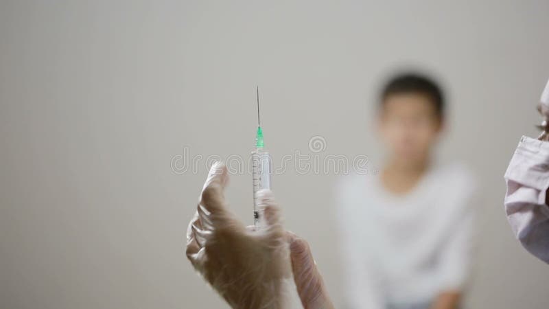 Cute Little Boy Afraid of Injection. Nurse Prepares a Syringe Stock ...