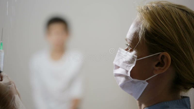 Cute Little Boy Afraid of Injection. Nurse Prepares a Syringe Stock ...