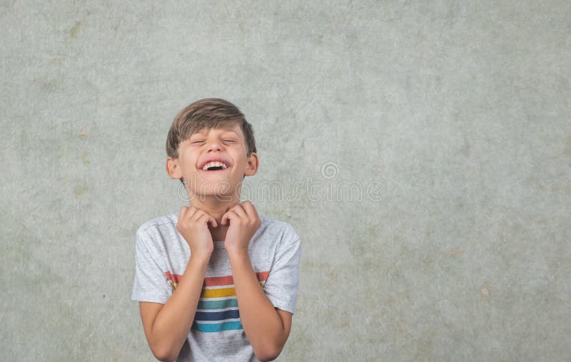 A Cute Autistic Elementary School Boy on a Blue Background with Copy ...