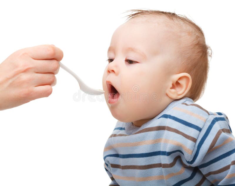 Cute Little Boy is Being Fed Using Spoon Stock Photo - Image of funny ...