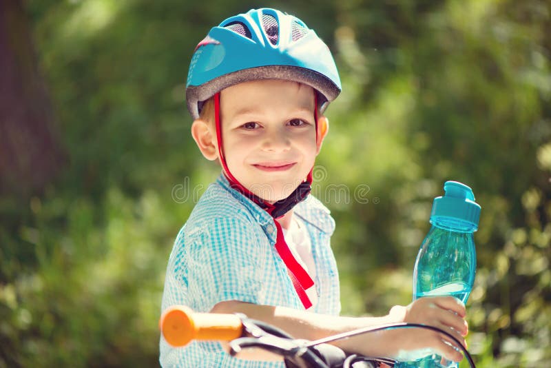 Cute little boy on bike stock image. Image of activity - 170957501