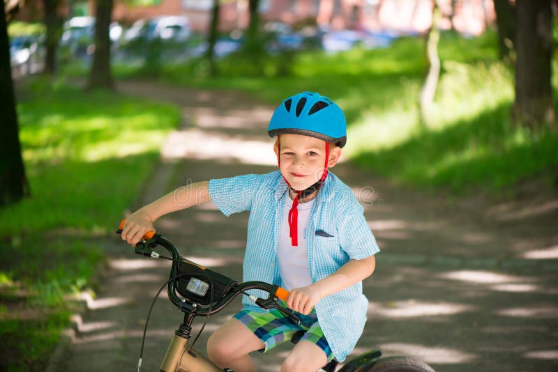 Cute little boy on bike stock image. Image of person - 56643387