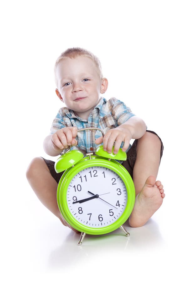 Boy looking up at a clock stock photo. Image of cute - 66516194