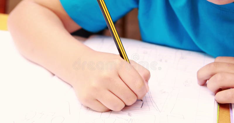 A Cute Boy Makes a Drawing with a Ruler and Pencil. Home Lessons ...