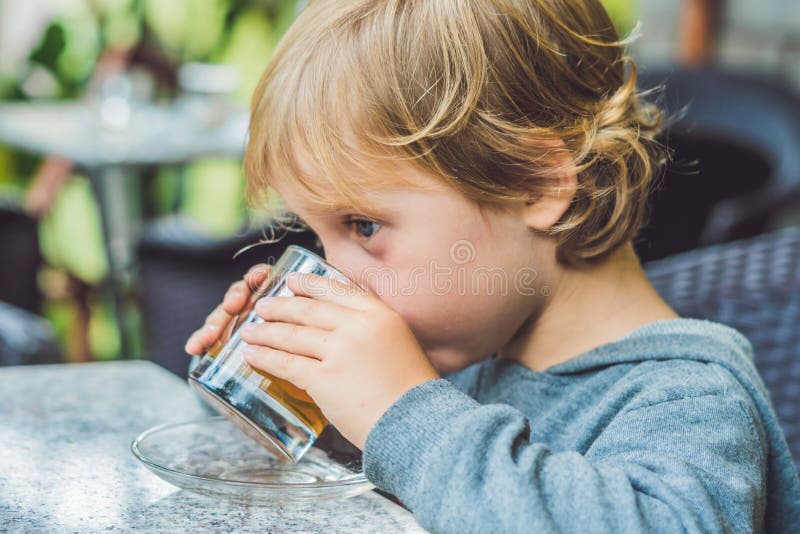 Cute Little Boy Drinking Tea in Cafeteria Stock Image - Image of ...