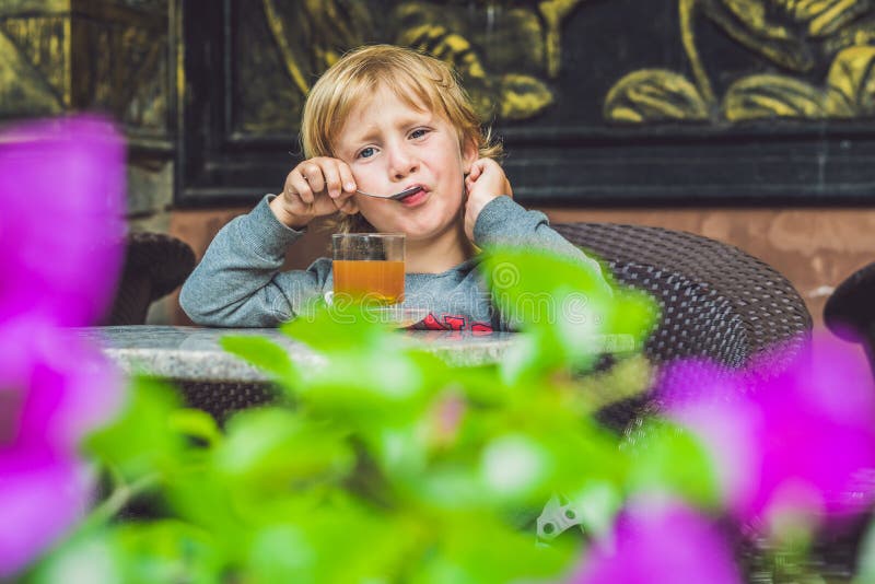 Cute Little Boy Drinking Tea in Cafeteria Stock Image - Image of ...