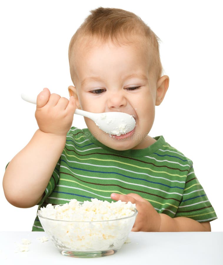 Cute Little Boy is Eating Cottage Cheese Stock Photo - Image of ...