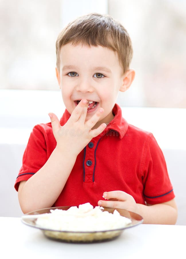 Cute Little Boy is Eating Cottage Cheese Stock Image - Image of ...