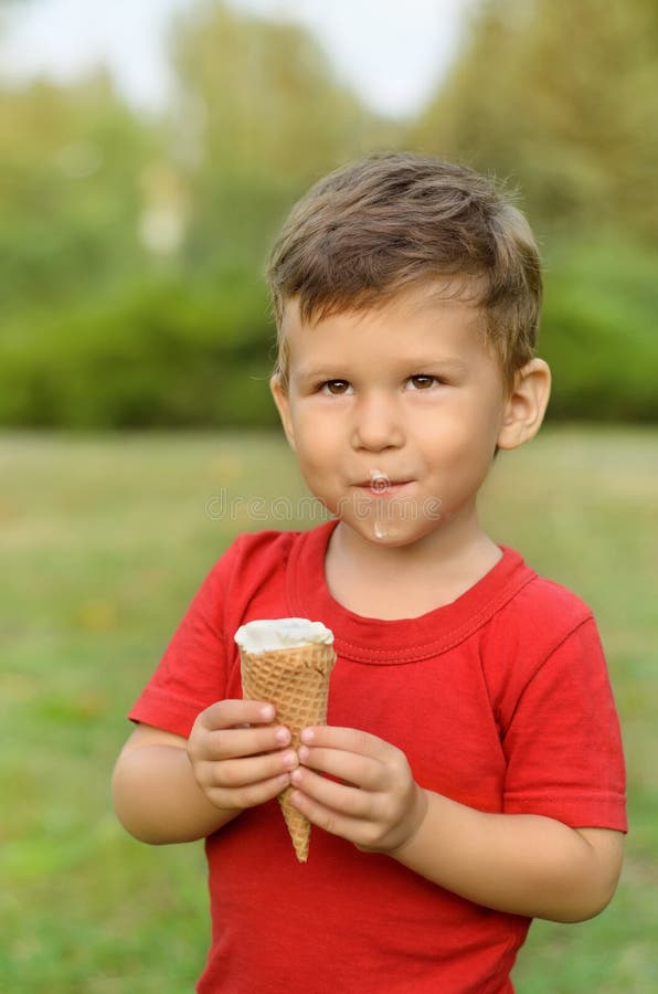 Cute Little Boy Eating Ice Cream Stock Photo - Image of face, cheerful ...
