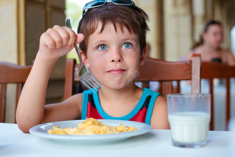 Cute Little Boy Having Delicious Breakfast Stock Photo - Image of ...