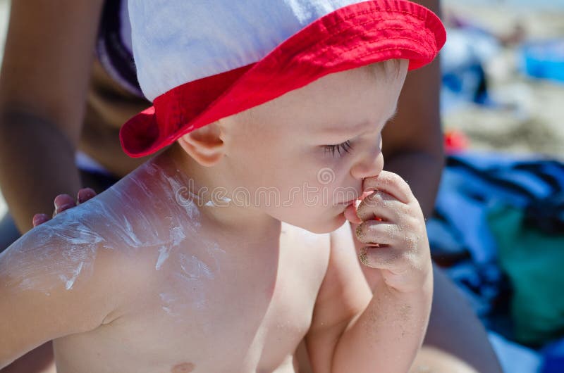 Cute Little Boy Having Sunscreen Applied Stock Image - Image of ...