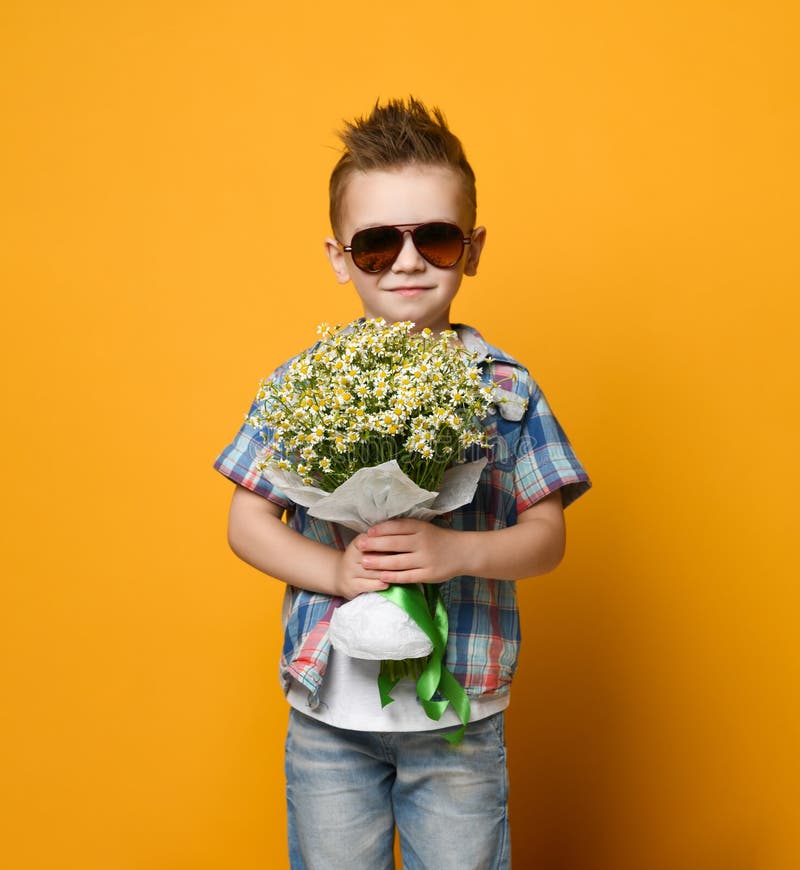 Cute Little Boy Holding a Bouquet of Flowers. Stock Image - Image of ... Cute Little Boy Holding a Bouquet of Flowers. Stock Image - Image of ...