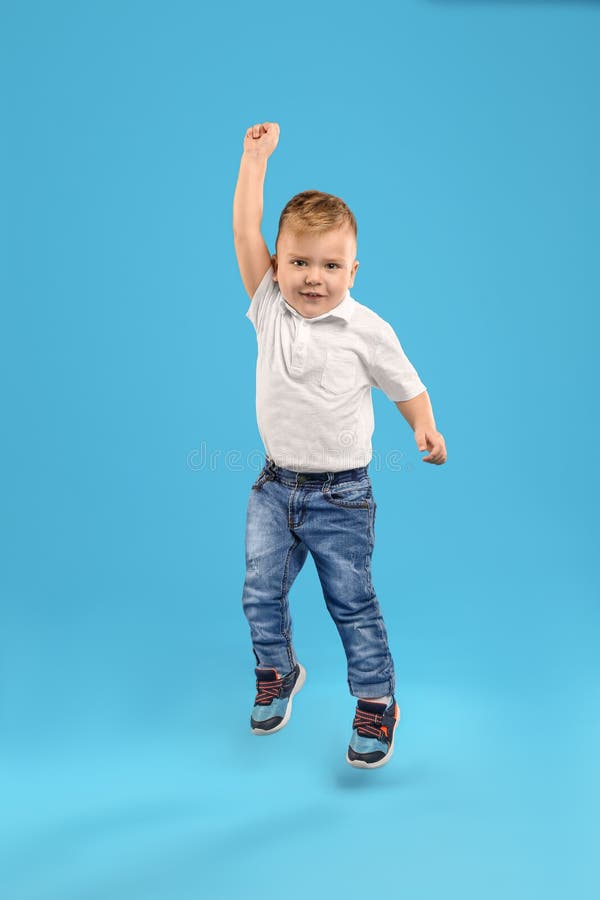 Cute Little Boy Jumping on Background Stock Image - Image of blue, cute ...
