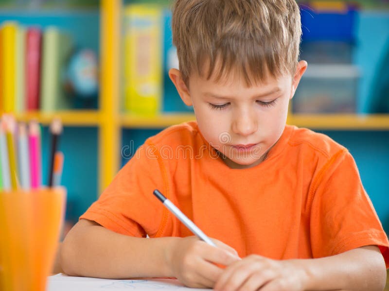 Blond Boy Child Kid with Pen Writing on Piece of Paper. at Home. Stock ...