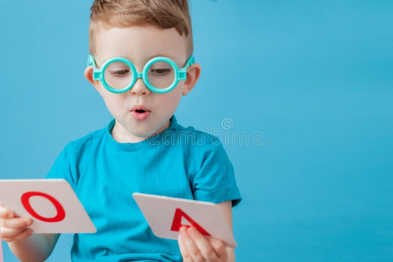 Cute Little Boy with Letter on Background. Child Learn Letters Stock ...