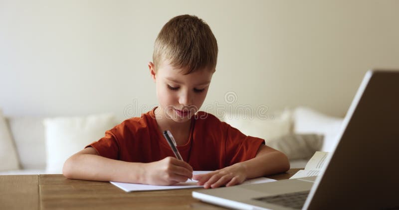 Cute Little Boy Makes Assignment Sit at Table with Laptop Stock Footage ...